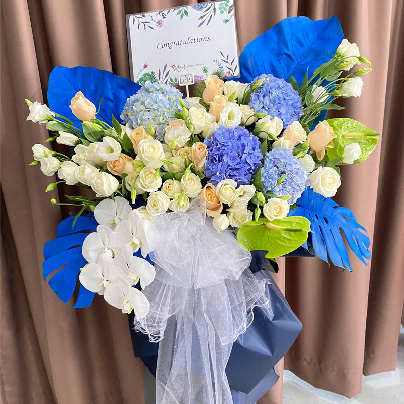 Blue Hydrangea Opening Stand with Champagne Roses & Orchids